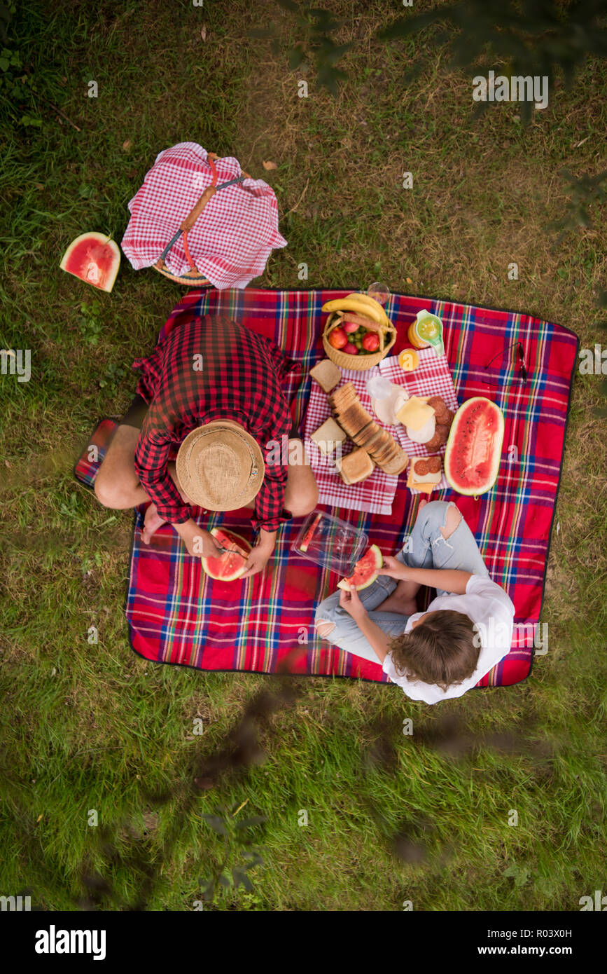 Couple in love enjoying picnic time drink and food in beautiful nature ...