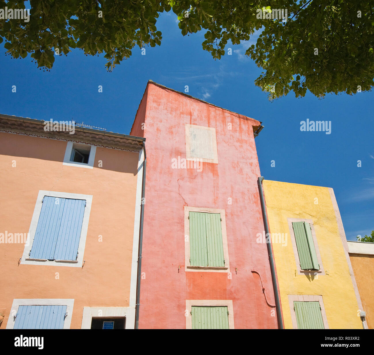 Multi-coloured buildings in centre of Roussillon, Provence, France ...