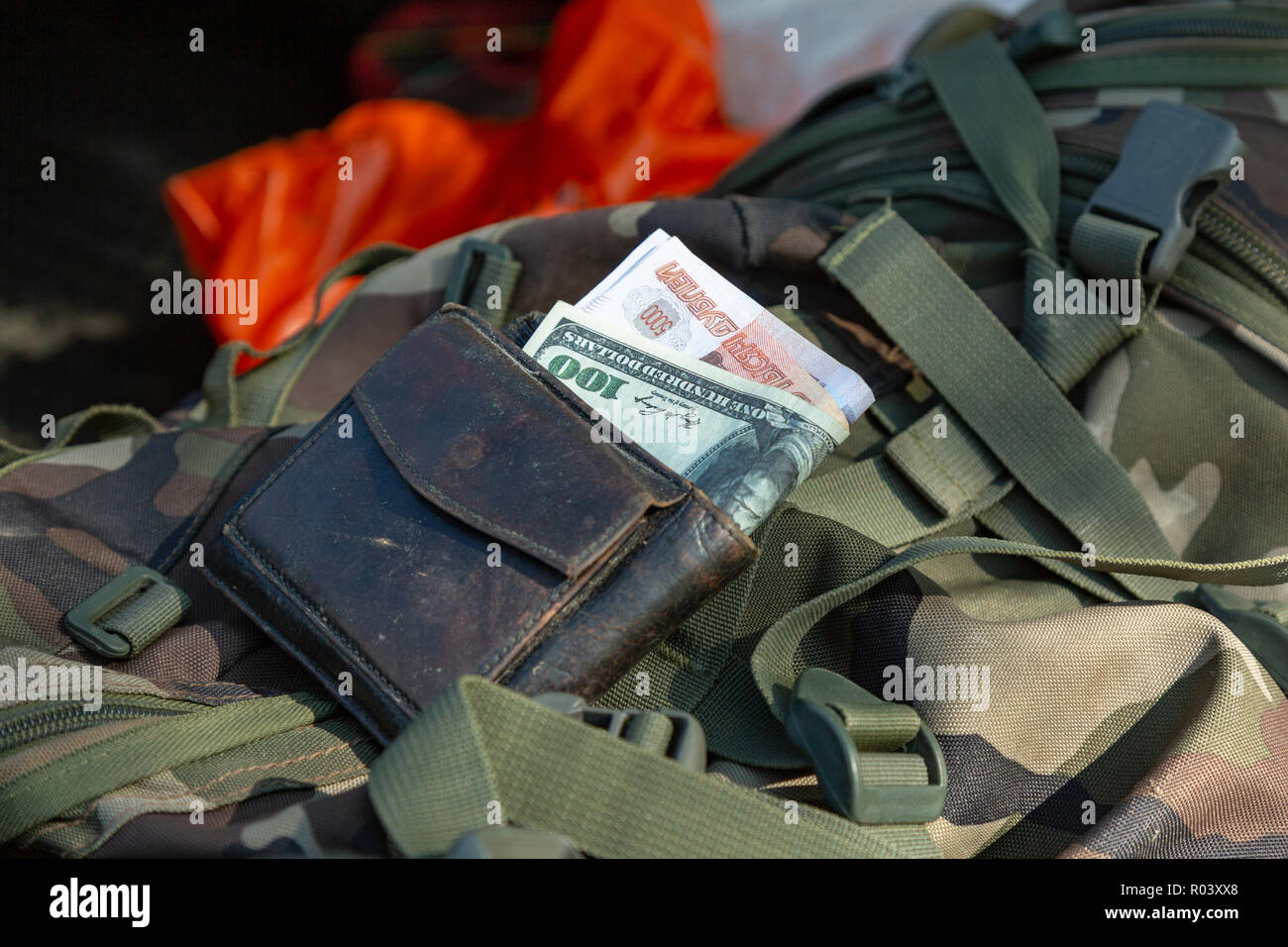 Corruption concept. Money of different countries in a wallet placed on ...