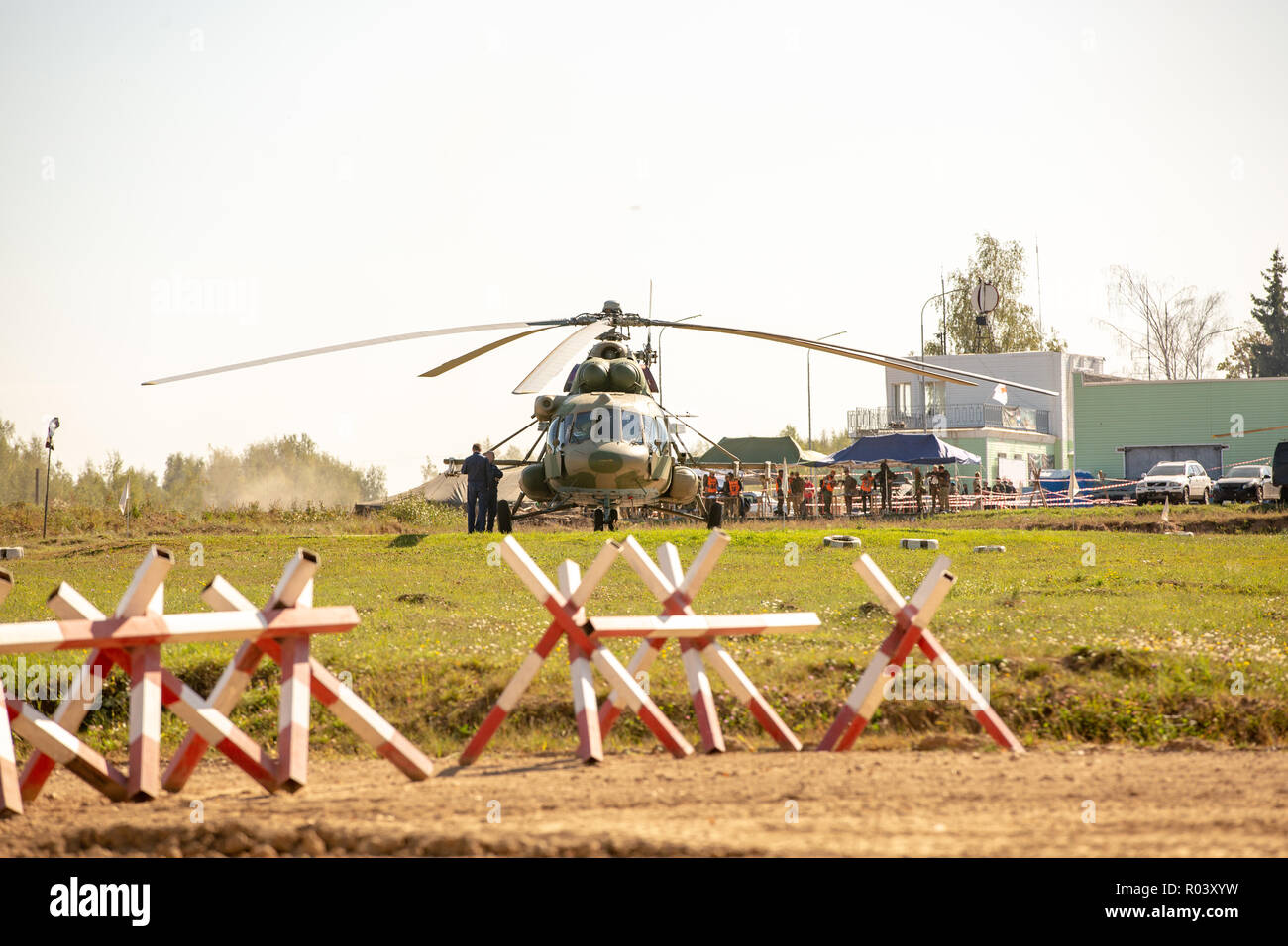 Military helicopter lands on the ground during Military Exercise Stock ...