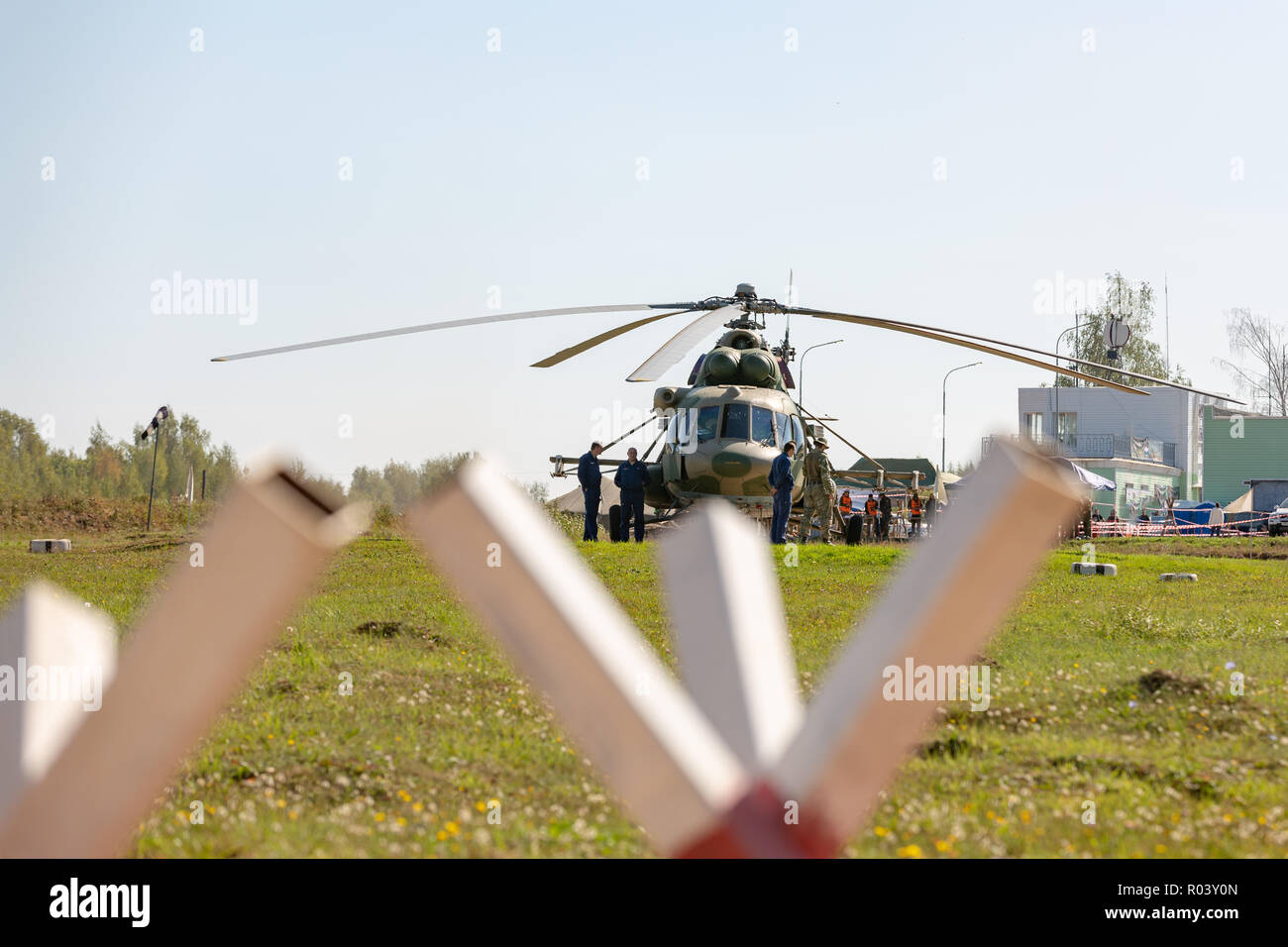 Military helicopter lands on the ground during Military Exercise Stock ...
