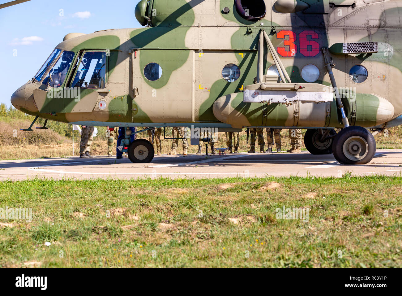 Military helicopter lands on the ground during Military Exercise Stock ...