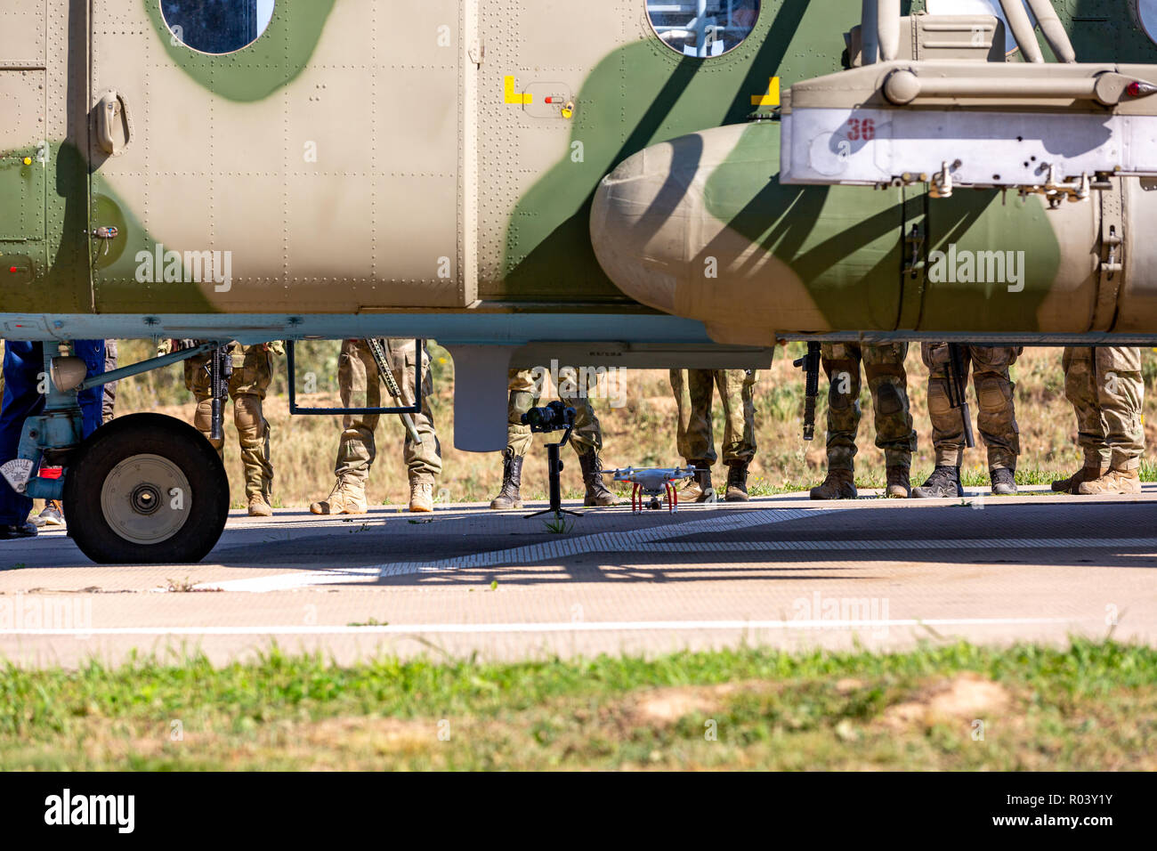 Military helicopter lands on the ground during Military Exercise Stock ...
