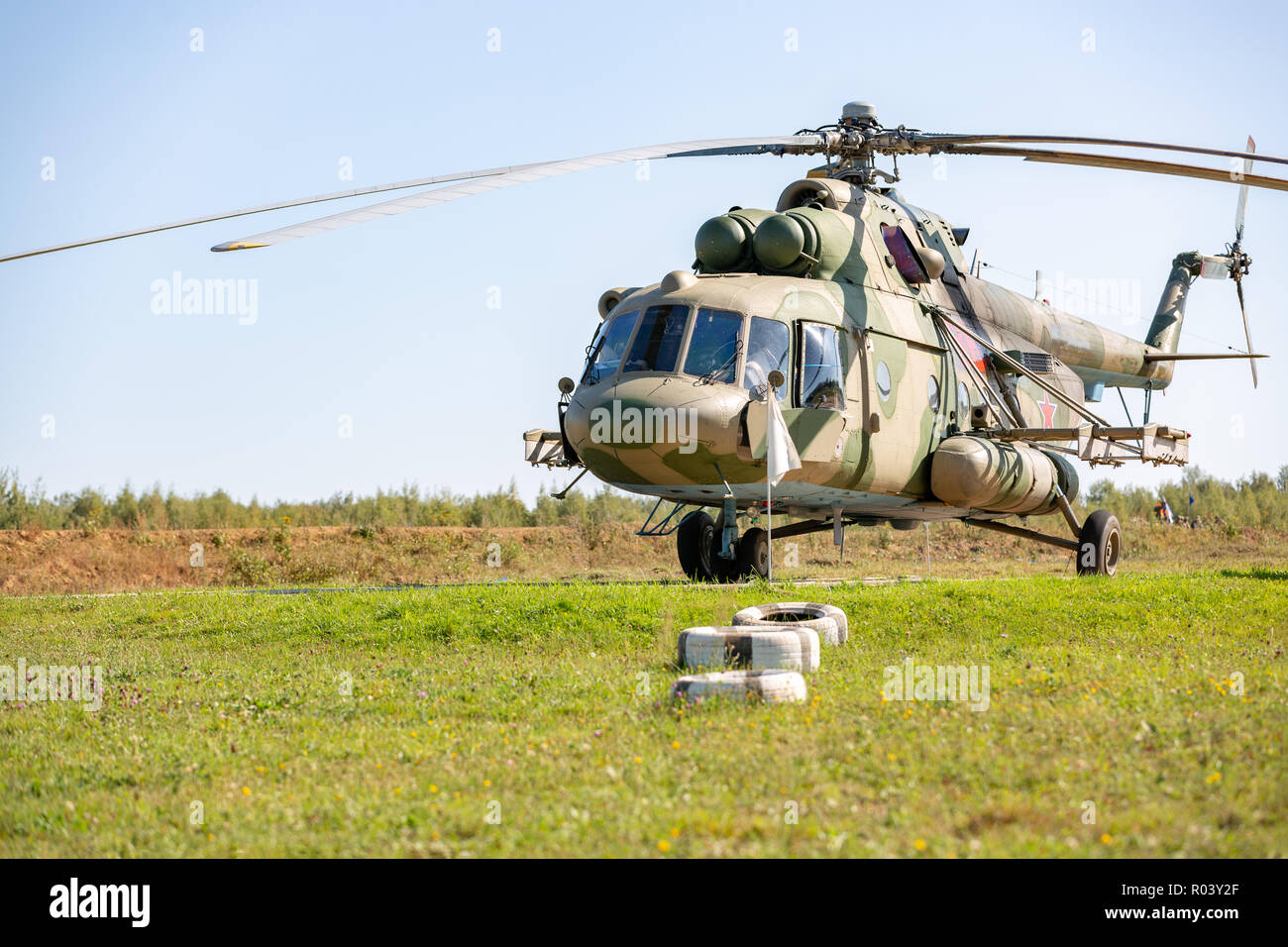 Military helicopter lands on the ground during Military Exercise Stock ...