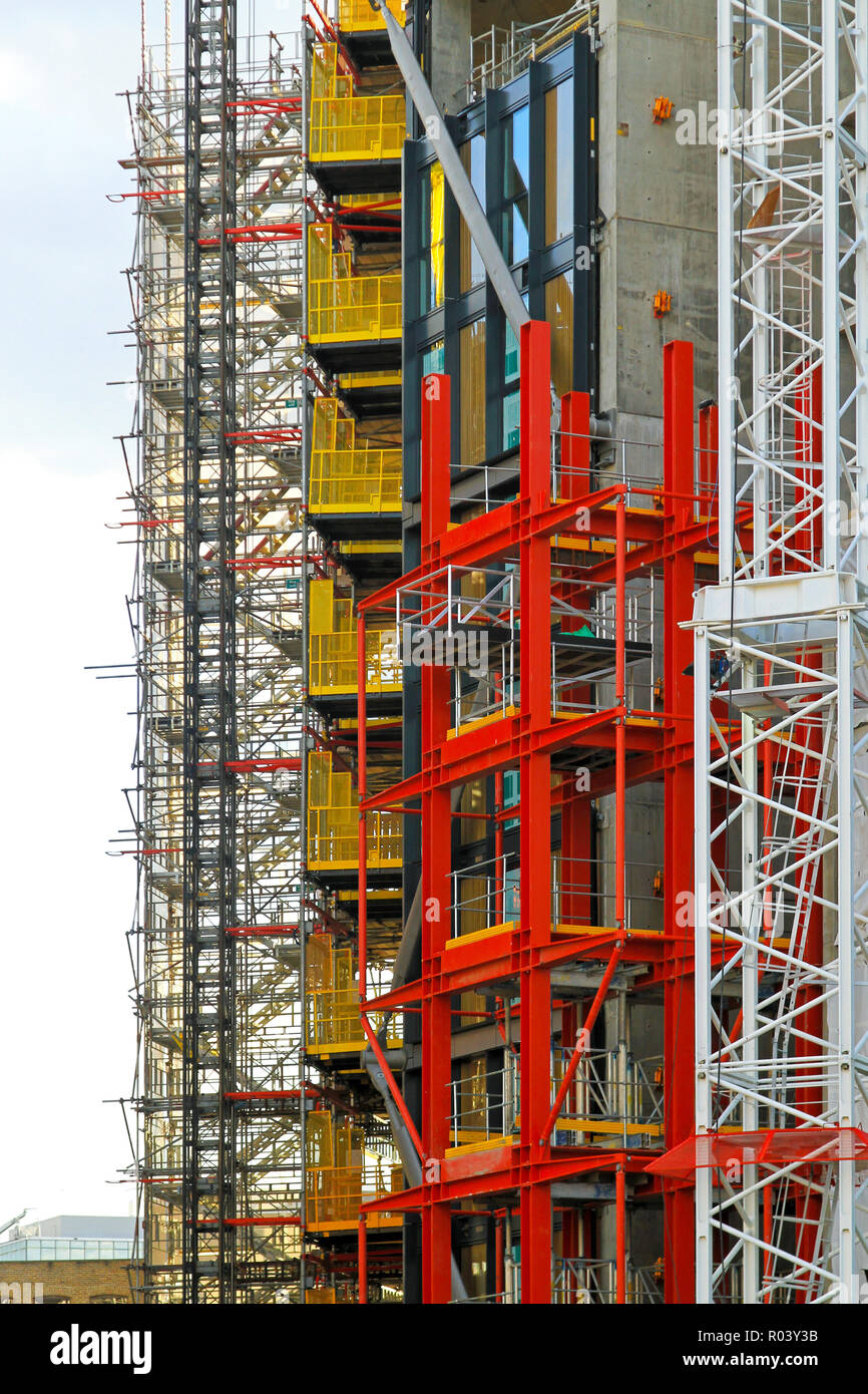 Detail of large building construction site with metal scaffoldings ...
