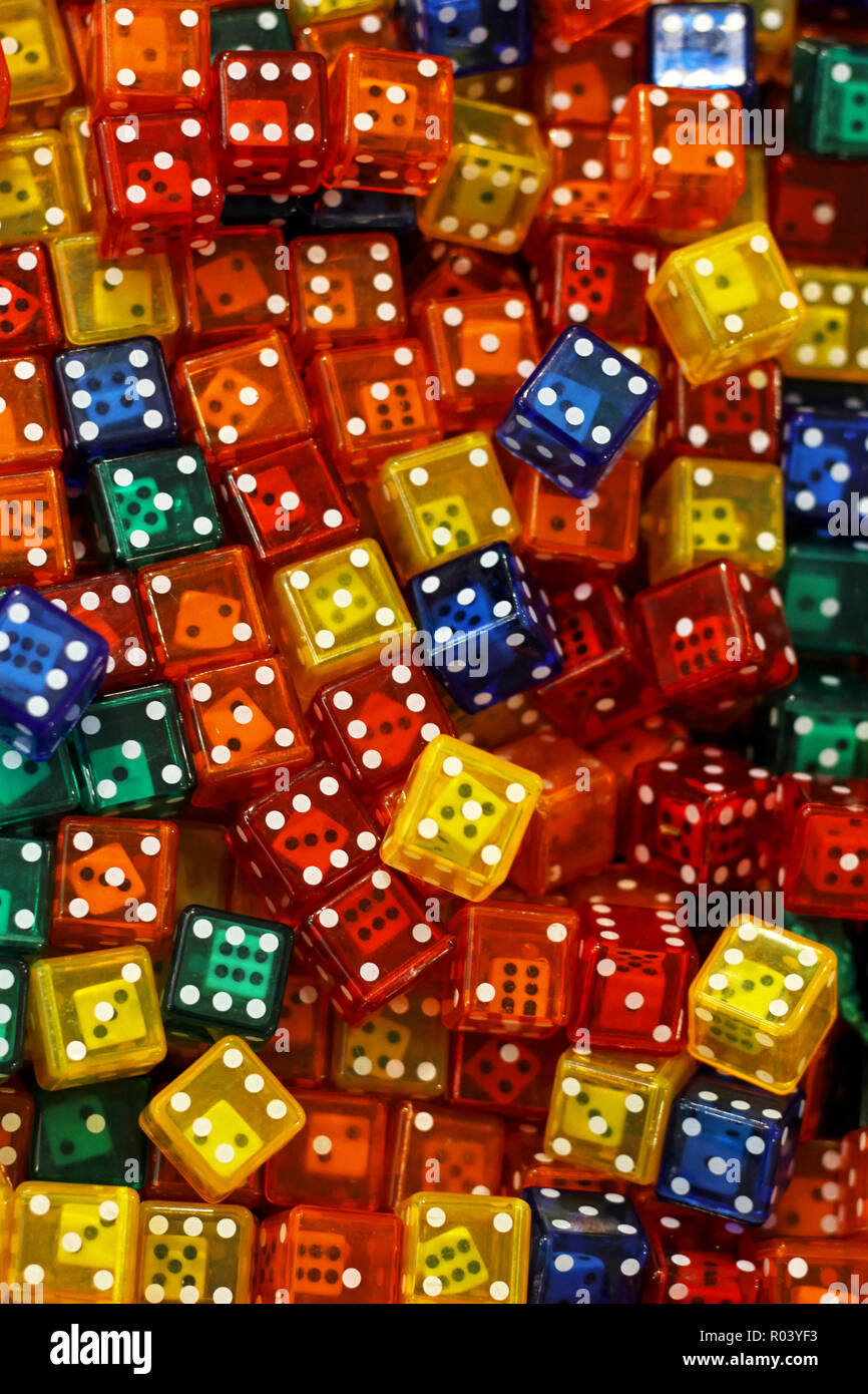 Big pile of plastic colorful dices with another dice inside Stock Photo ...