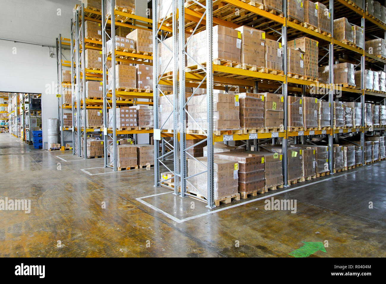 Boxes in modern logistic distribution storehouse interior Stock Photo ...