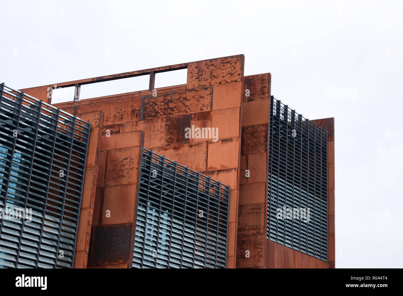 Industrial rusty building with modern windows. Old and new architecture ...