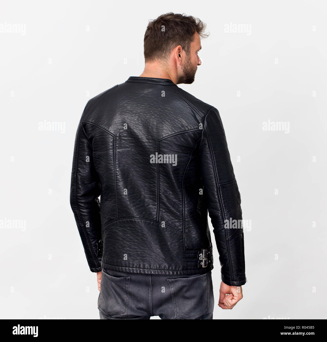 Back view of man with beard wearing black clothes, isolated Stock Photo ...