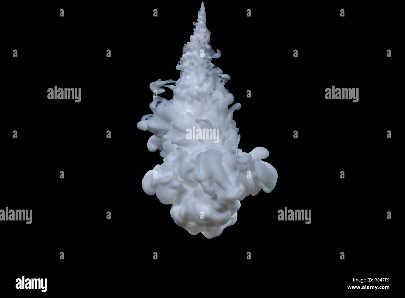 Explosion of white acrylic paint in water on black background Stock ...