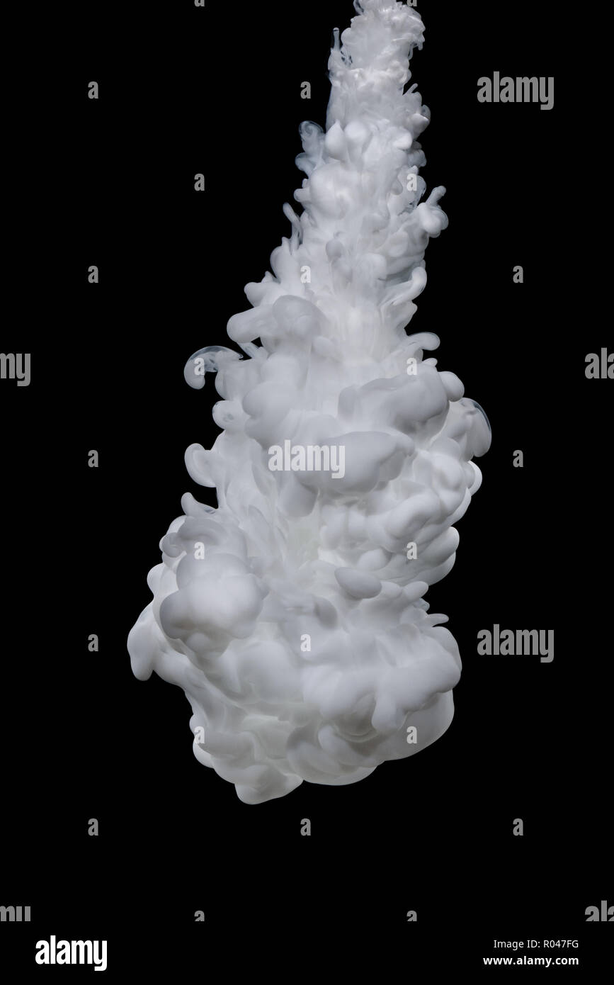 Explosion of white acrylic paint in water on black background Stock ...