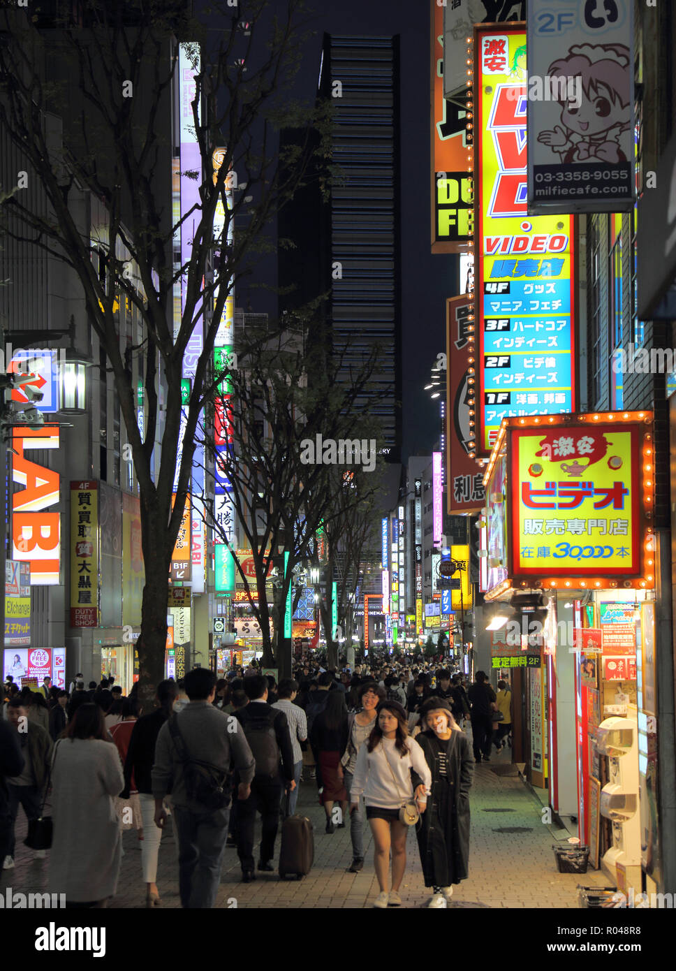 bright advertising signs and street scenes in the shinjuku area of ...