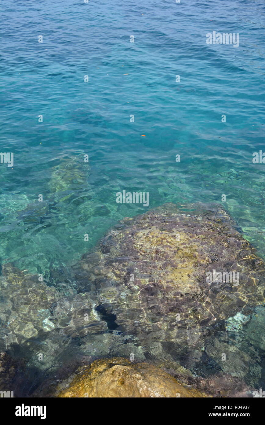 Crystal clear greek water Stock Photo - Alamy