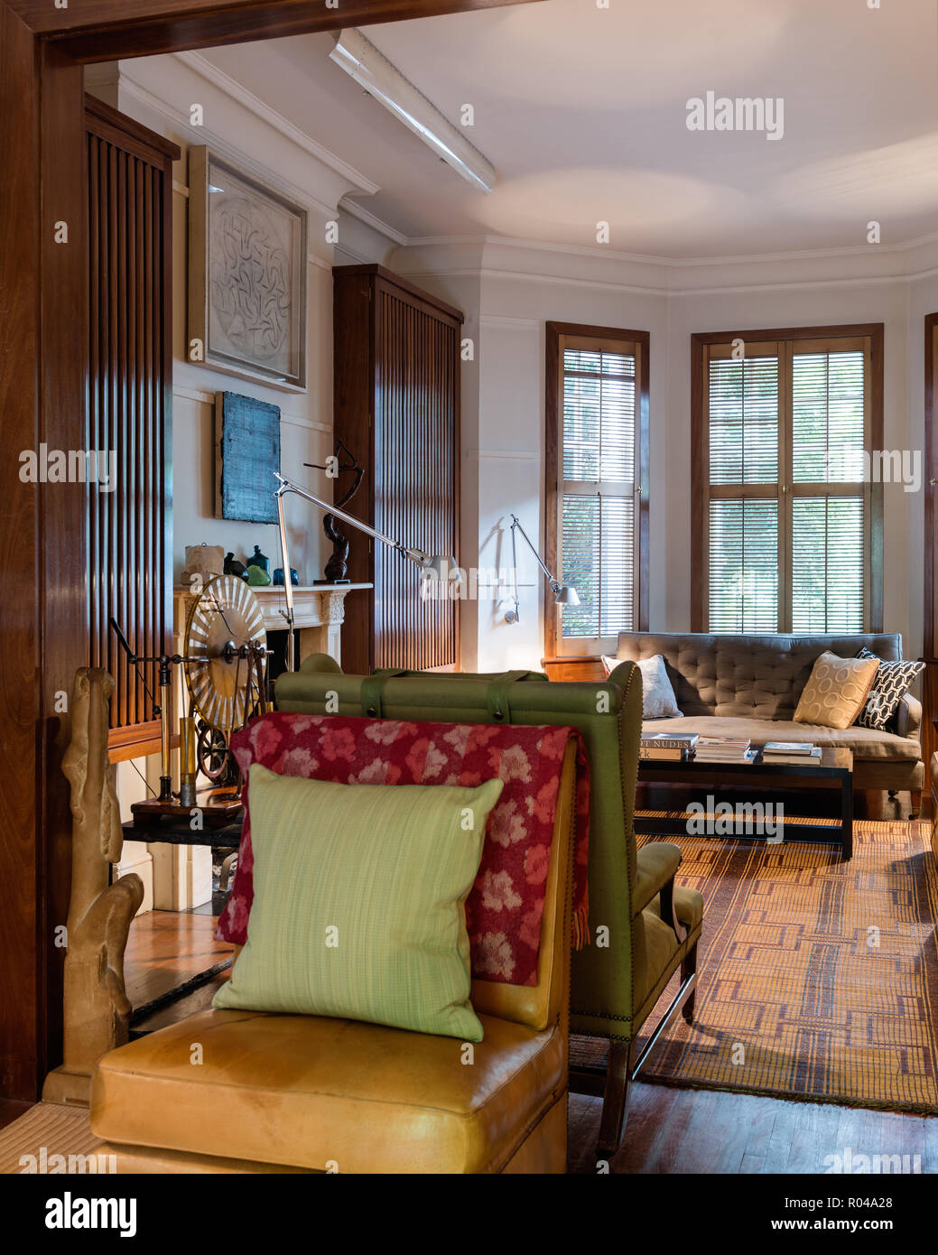 Chairs in eclectic living room Stock Photo - Alamy