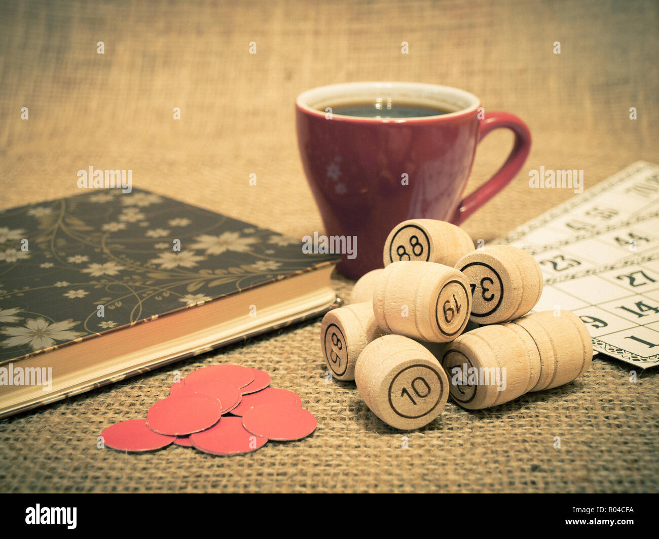 Board game lotto. Wooden lotto barrels, game cards, red chips for a ...