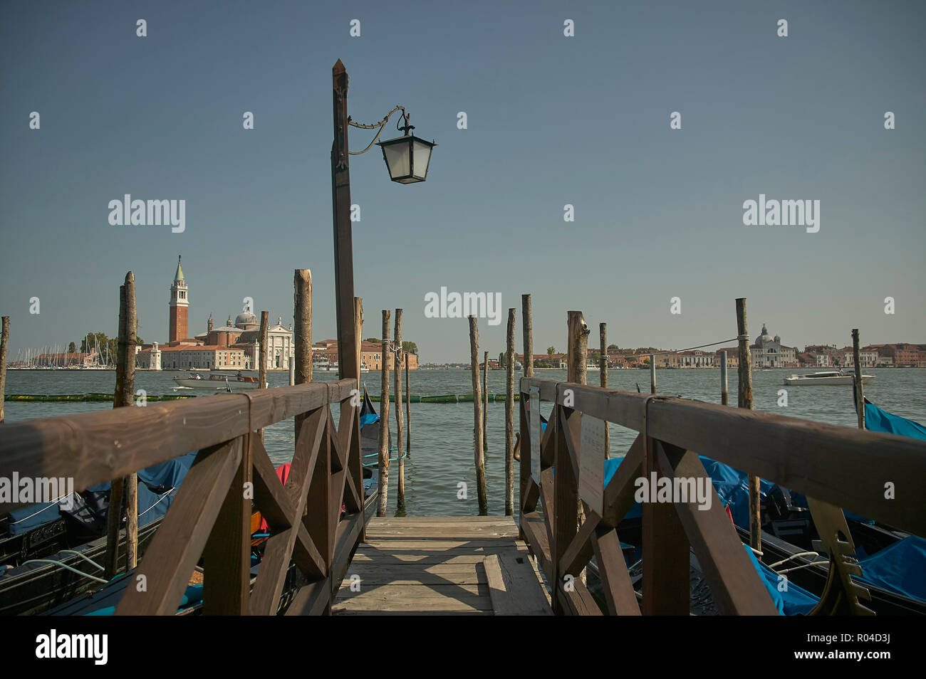 Small jetty or mooring for wooden gondola in Venice with views of the ...