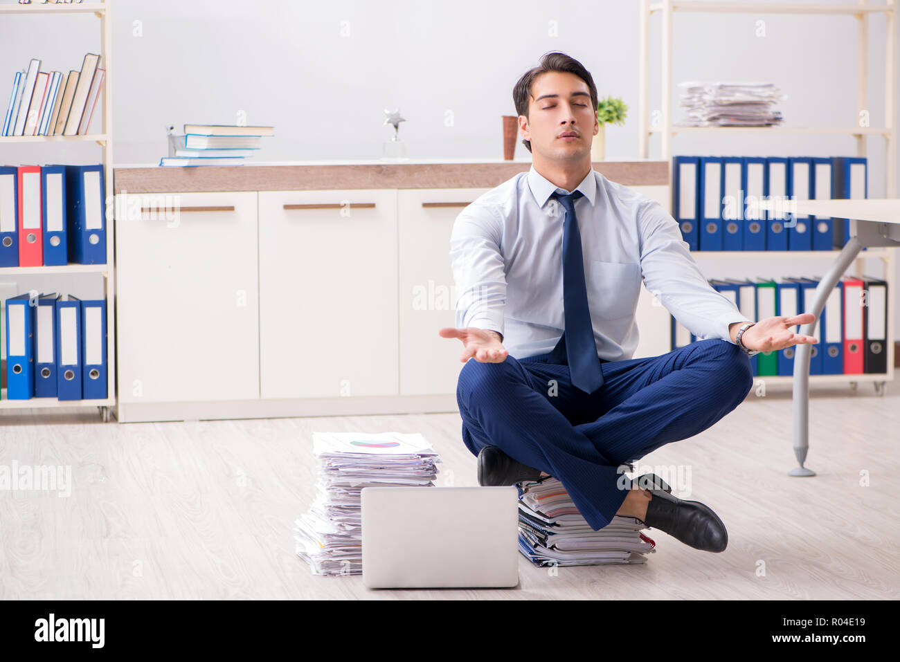 Extremely busy employee working in the office Stock Photo - Alamy