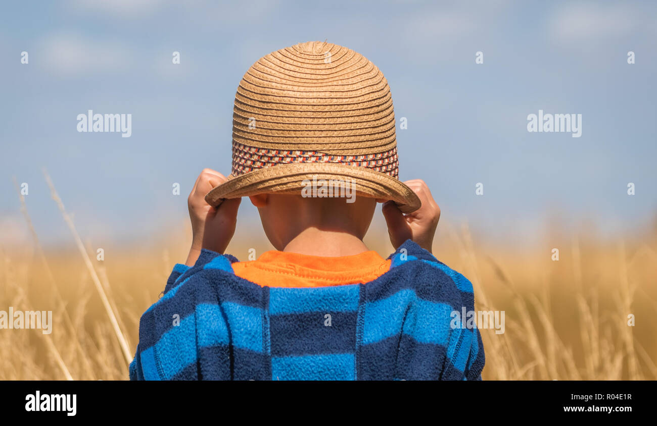 Boy wearing straw hat hi-res stock photography and images - Alamy