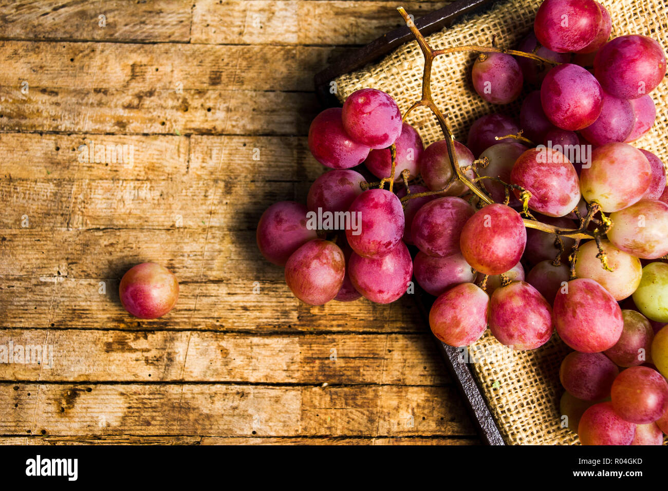 Grapes on wooden rustic table hi-res stock photography and images - Alamy