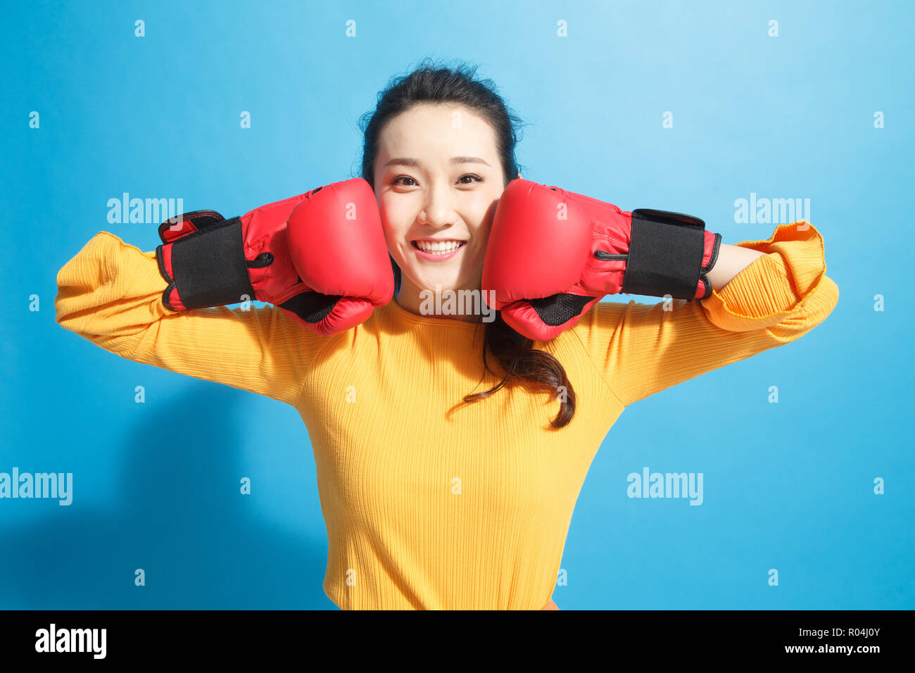 Asian woman boxer smiling hi-res stock photography and images - Alamy