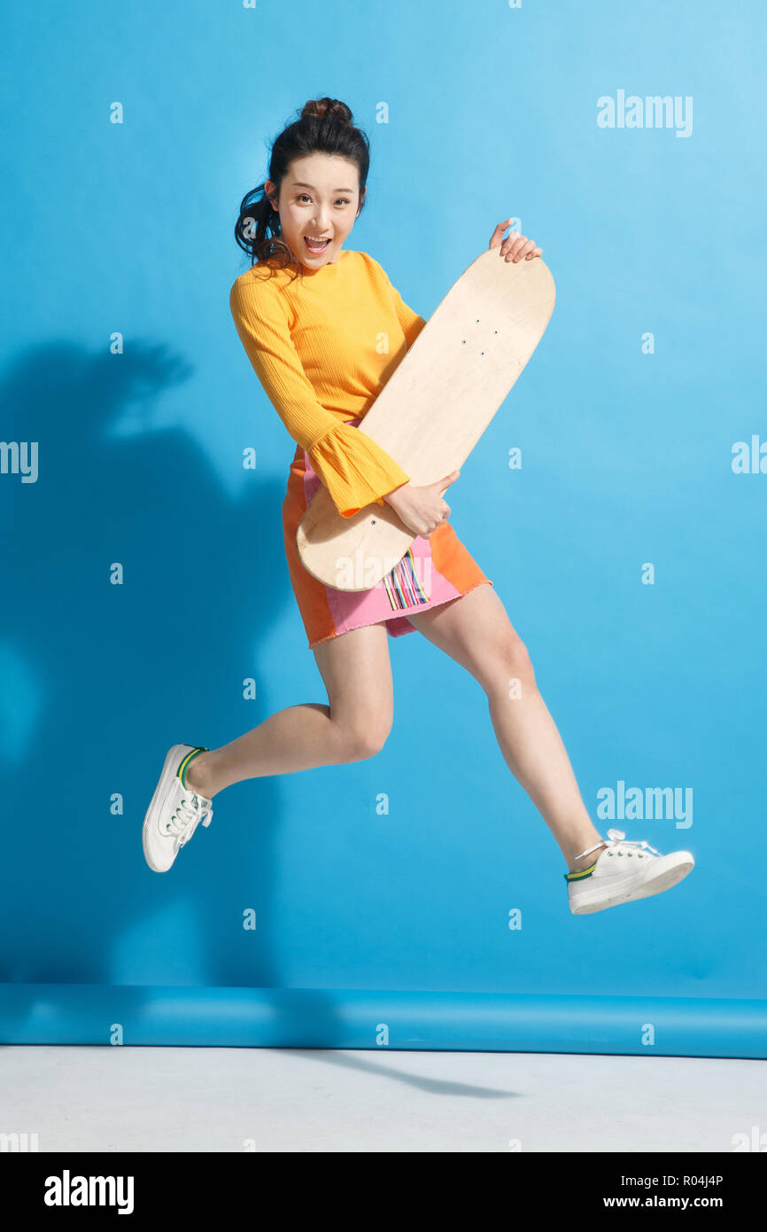 Young women skateboarding Stock Photo - Alamy