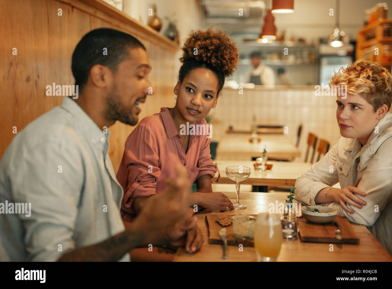 People enjoying food and drink at bistro bar hi-res stock photography ...