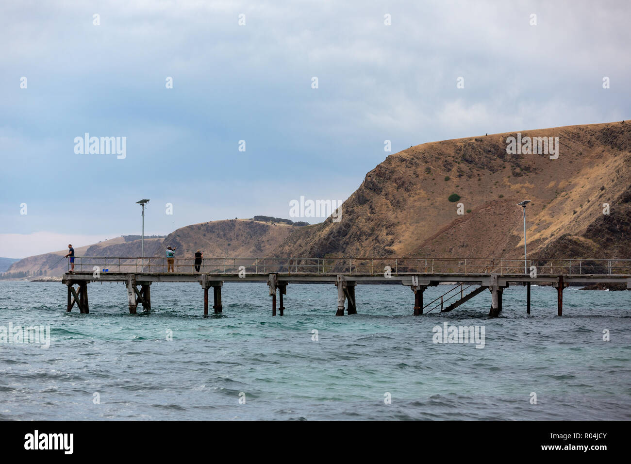 People fishing on the iconic Second Valley jetty on an overcast day on ...