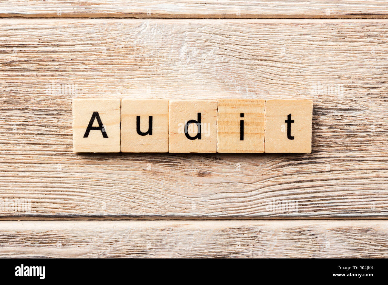 audit word written on wood block. audit text on table, concept Stock ...