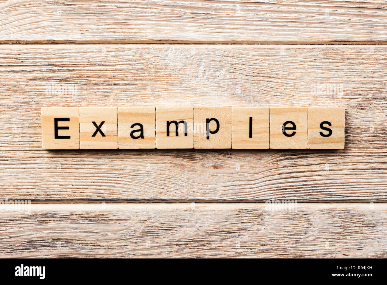 examples word written on wood block. examples text on table, concept ...