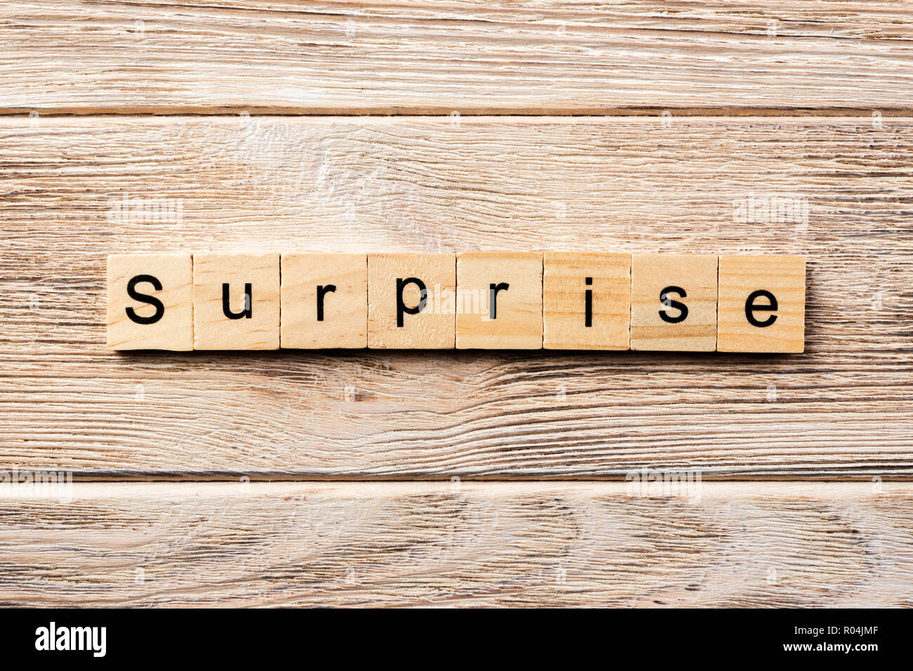 surprise word written on wood block. surprise text on table, concept ...