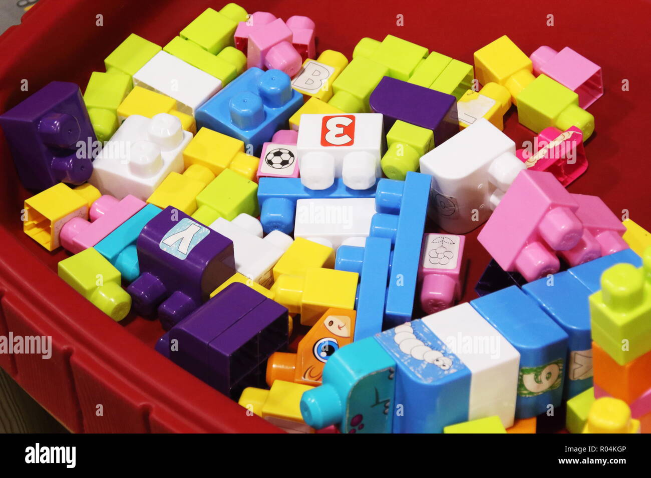 Red Wagon filled with colorful child's building blocks Stock Photo - Alamy
