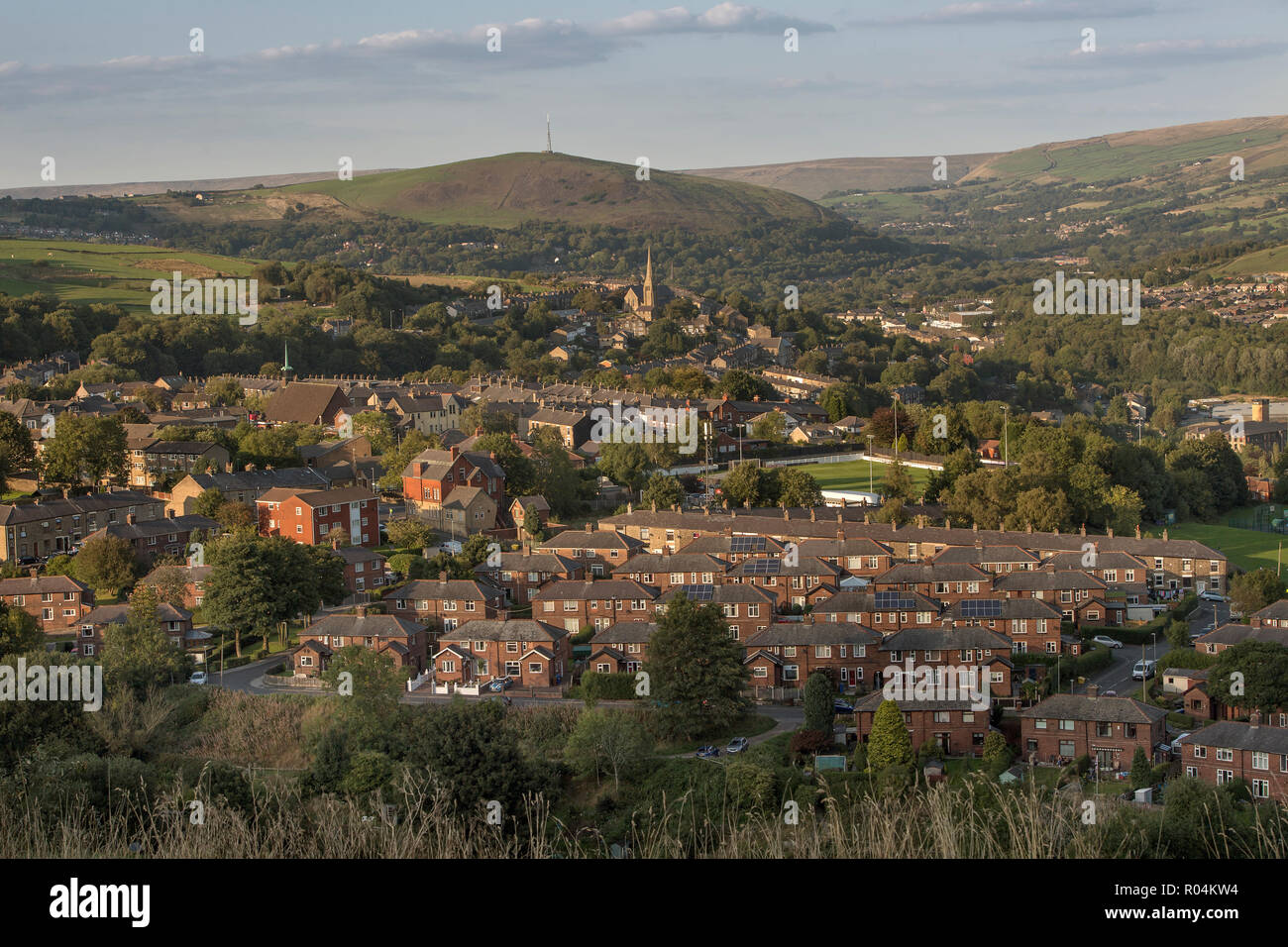 General view of Seel Park, home of Mossley AFC with St John the Baptist ...
