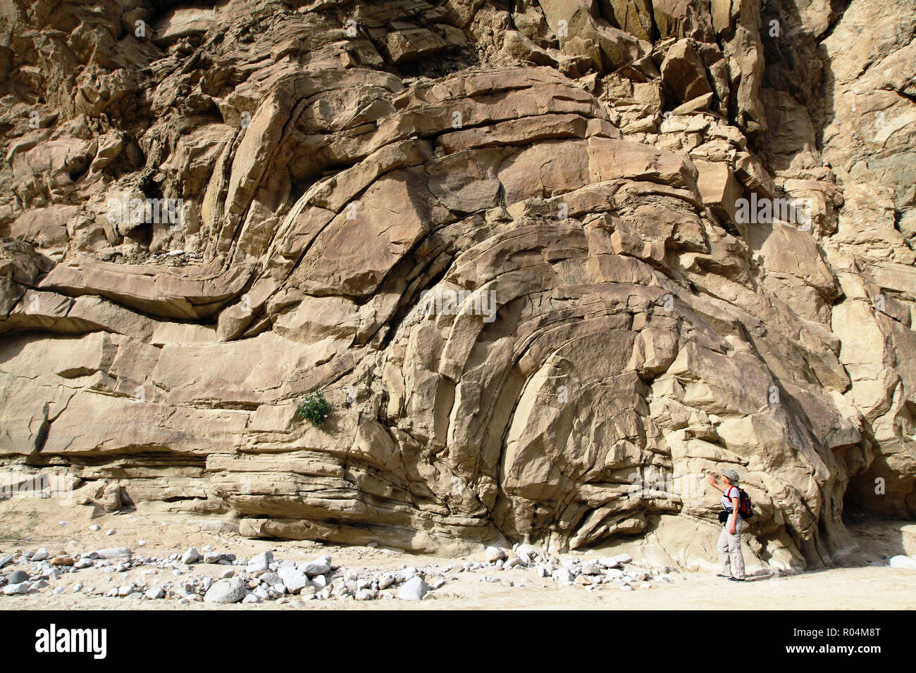 folded rocks with human for scale Stock Photo - Alamy