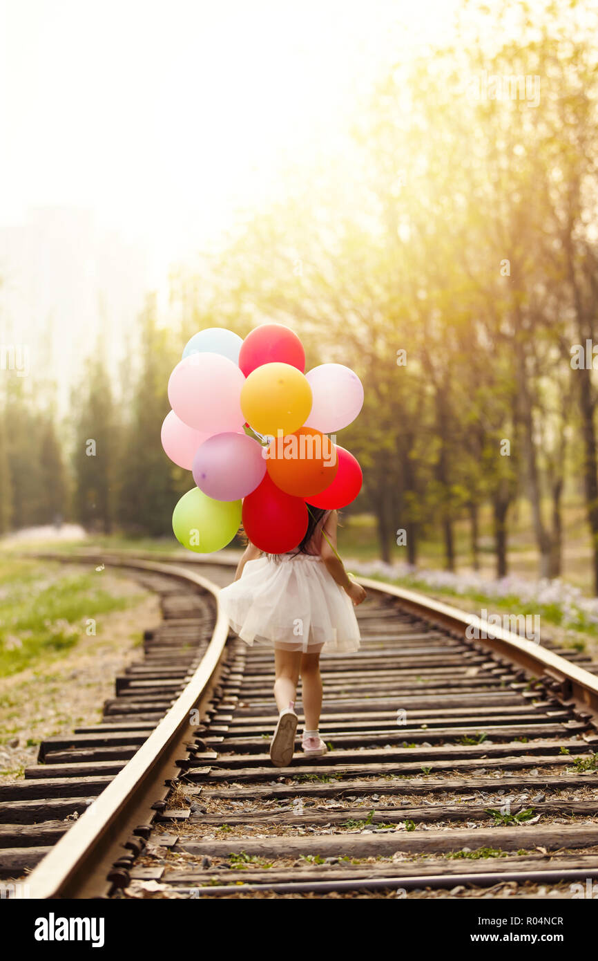 Girl running looking back rear view hi-res stock photography and images ...