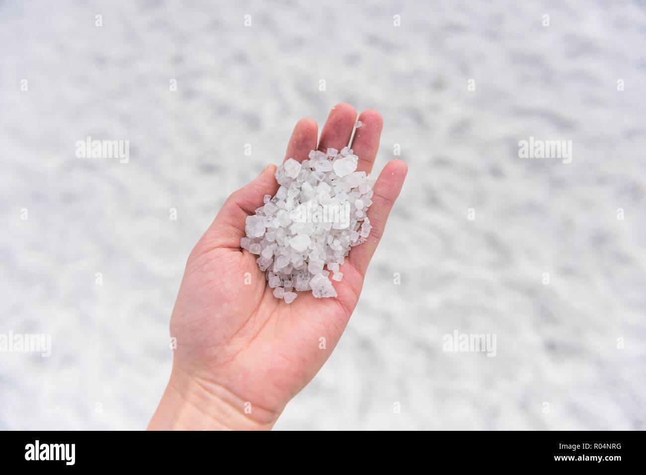 Holding Natural Sea Salt in his Hand Stock Photo - Alamy