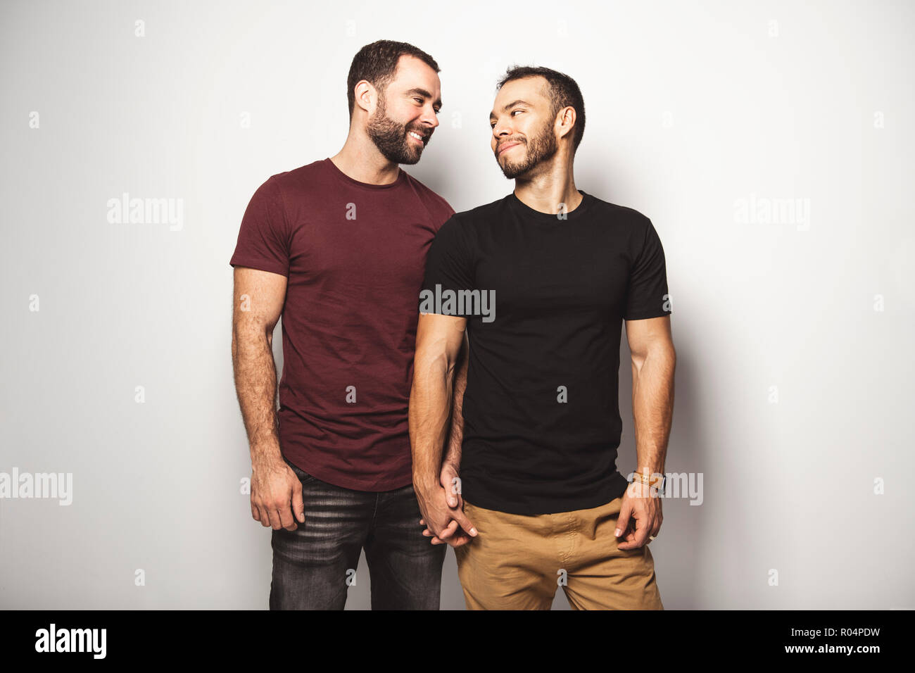 Young Homosexuals Gay Couple Love Each Other On A White Background