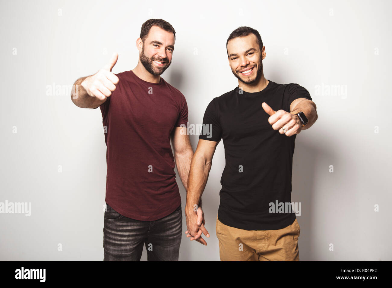 Young Homosexuals Gay Couple Love Each Other On A White Background