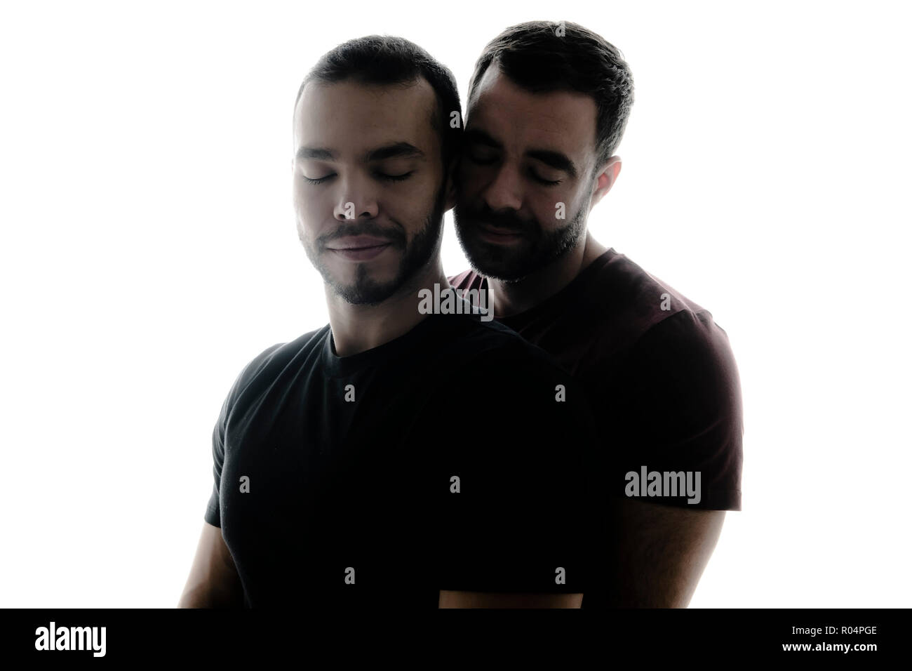 Young homosexuals shadow couple love each other on a white background ...