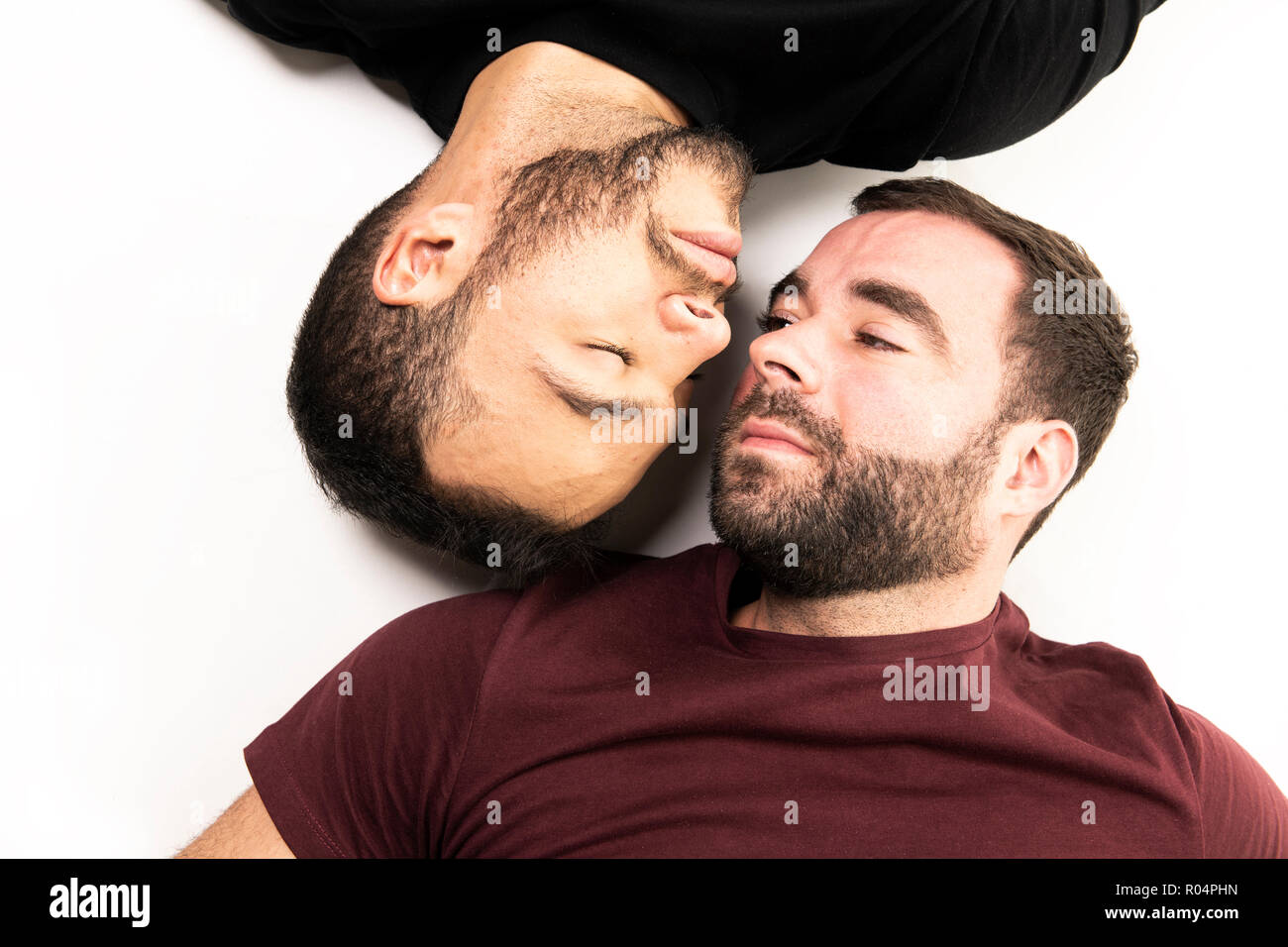 Young Homosexuals Gay Couple Love Each Other On A White Background