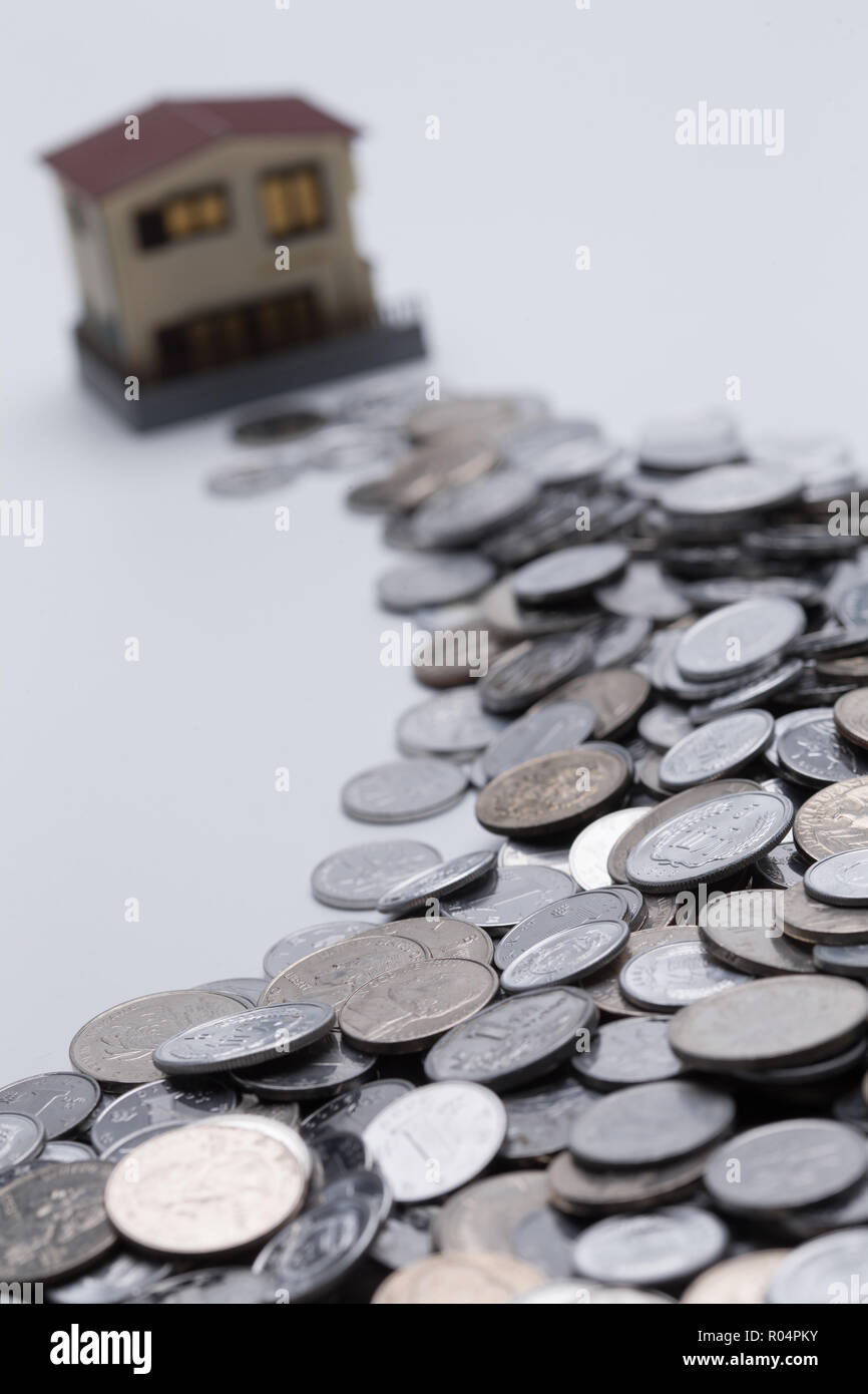 COINS and building model Stock Photo - Alamy