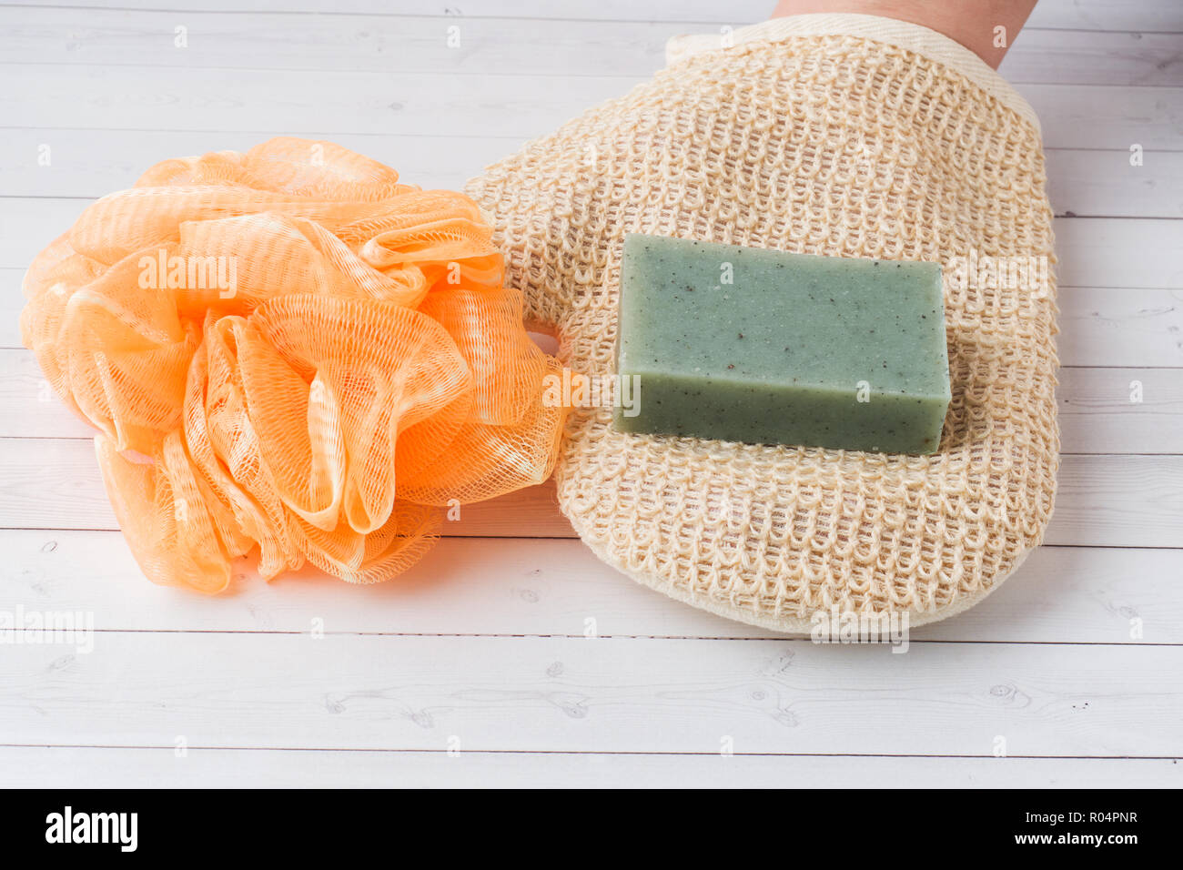 Spa and Wellness concept on white background. Washcloth mitten with ...