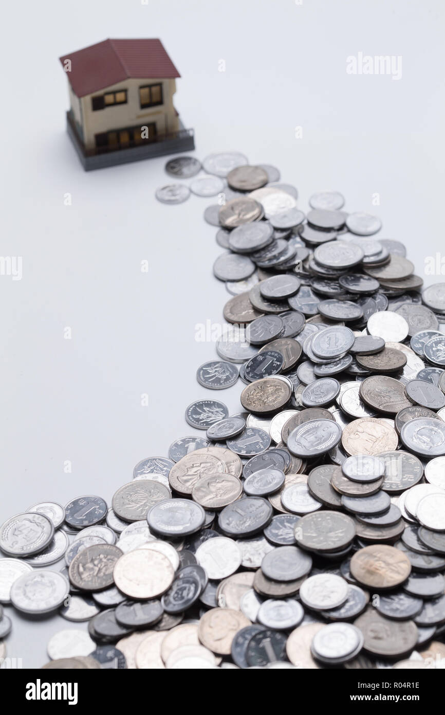 COINS and building model Stock Photo - Alamy