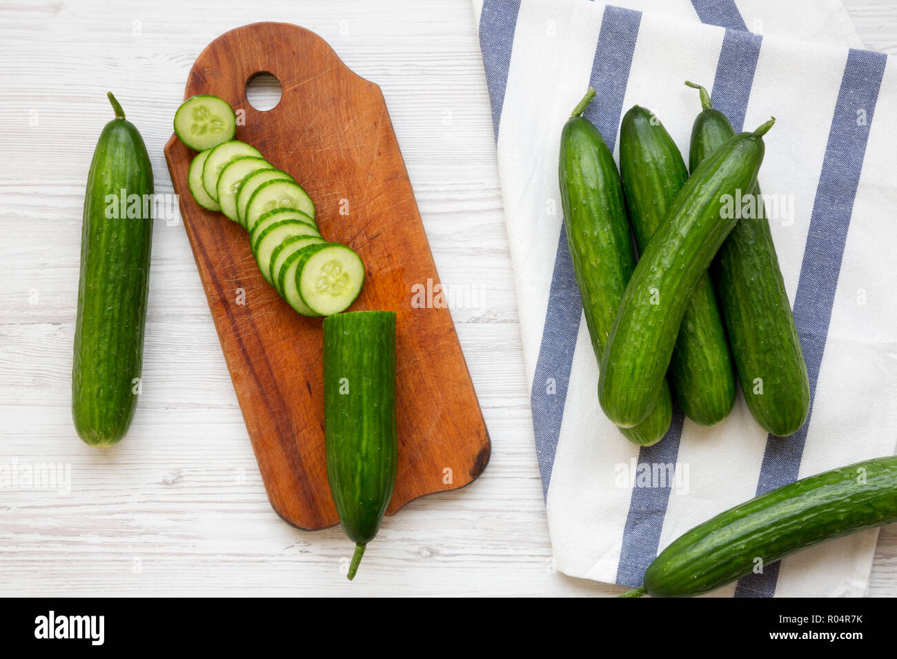 Fresh raw green cucumbers, top view. Flat lay, from above, overhead ...