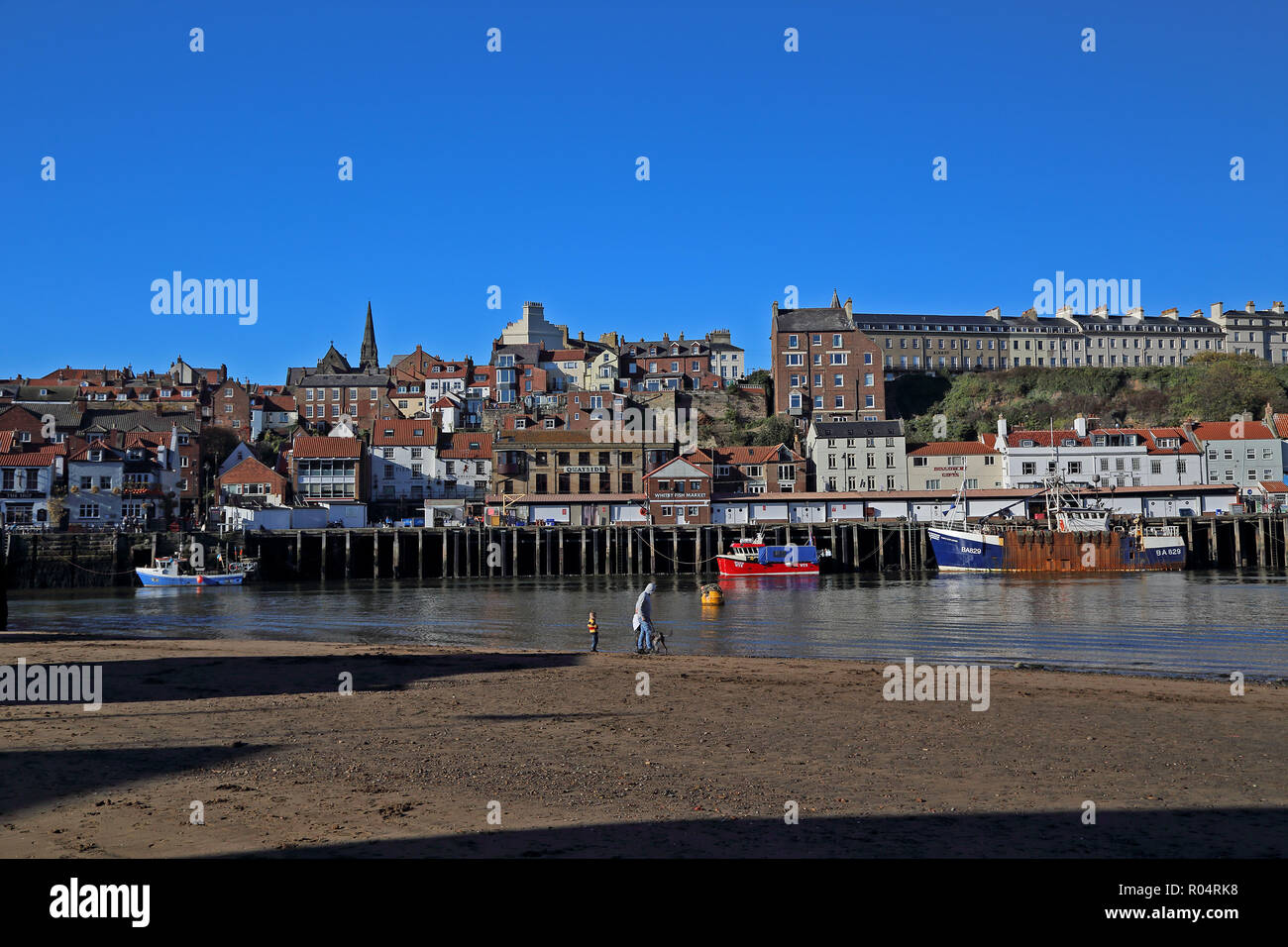 A view of Whitby, North Yorkshire, UK from the Old Town looking across ...