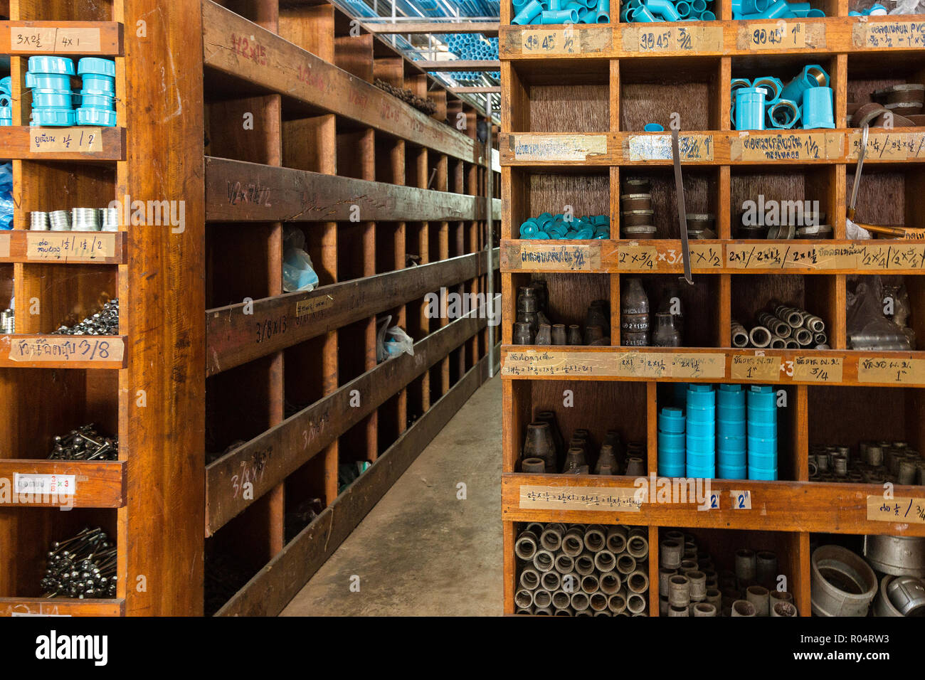 Wooden vintage shelves in DIY store with PVC parts Stock Photo - Alamy