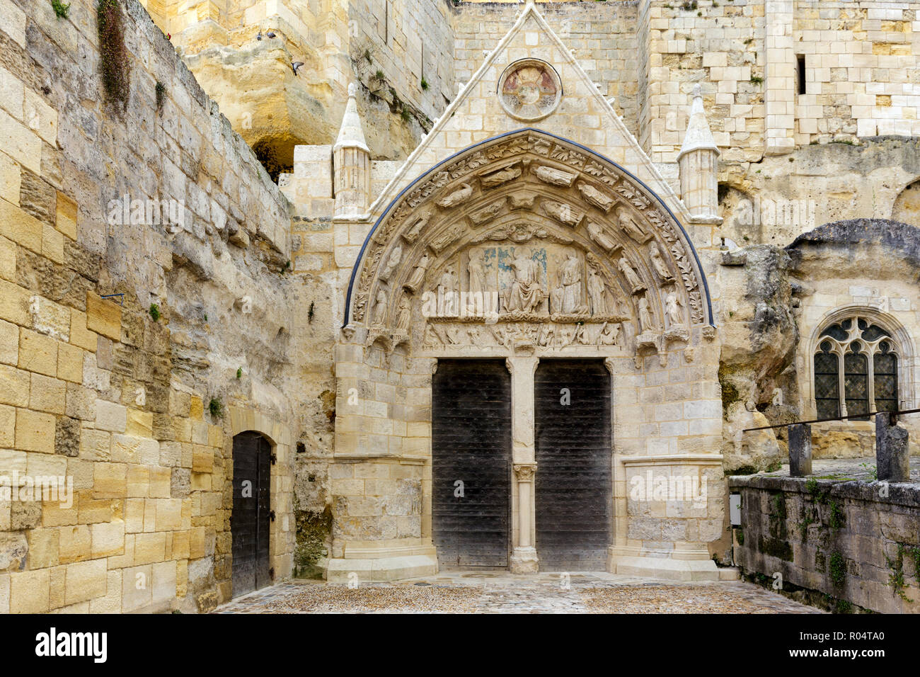 Entrance of old monolithic church in the Saint Emilion village near ...