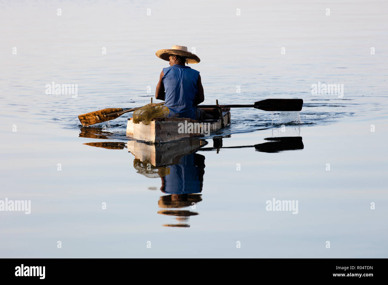 Fisherman on small rowing boat made of polystyrene blocks, Cienfuegos ...