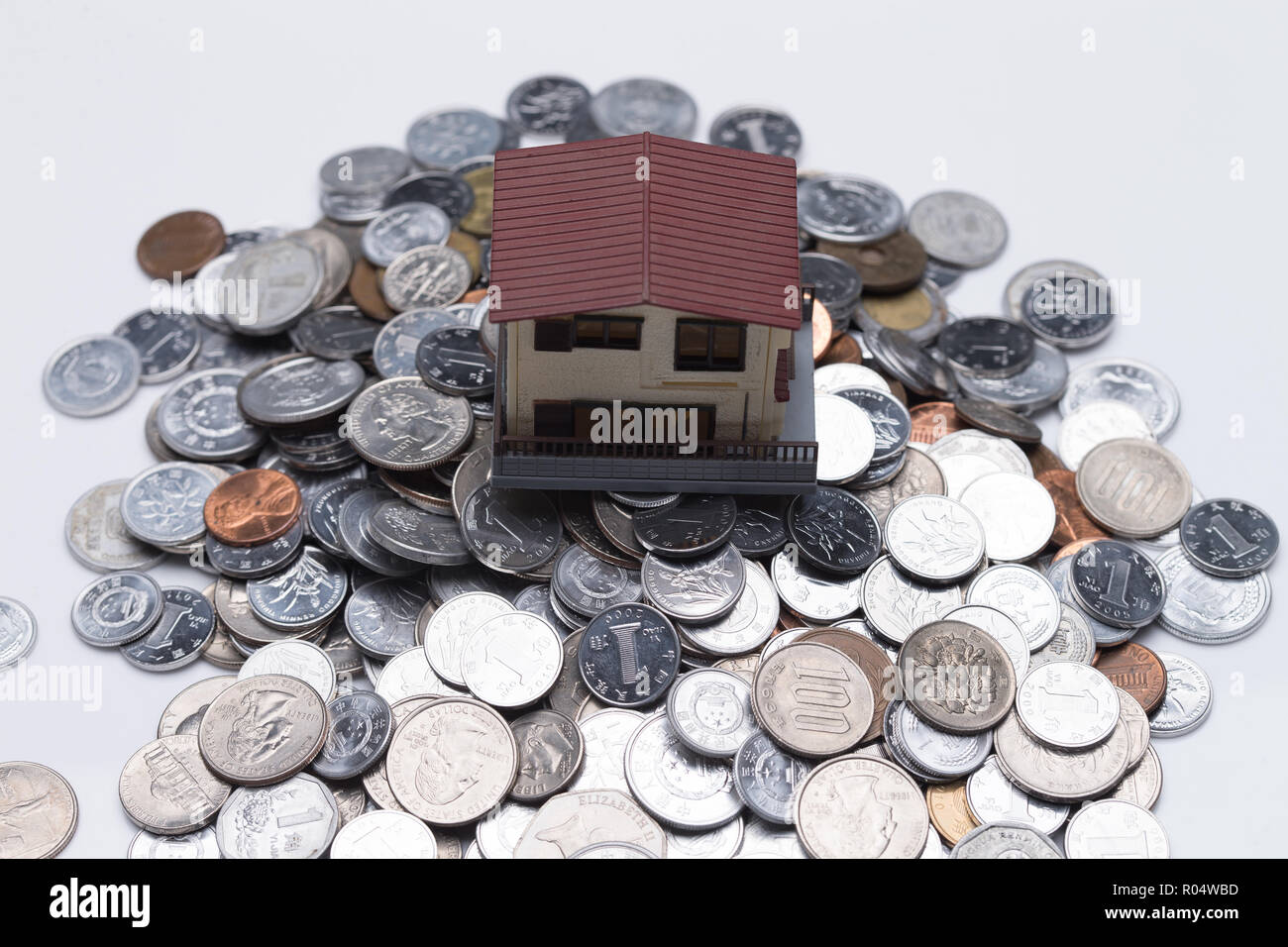 COINS and building model Stock Photo - Alamy