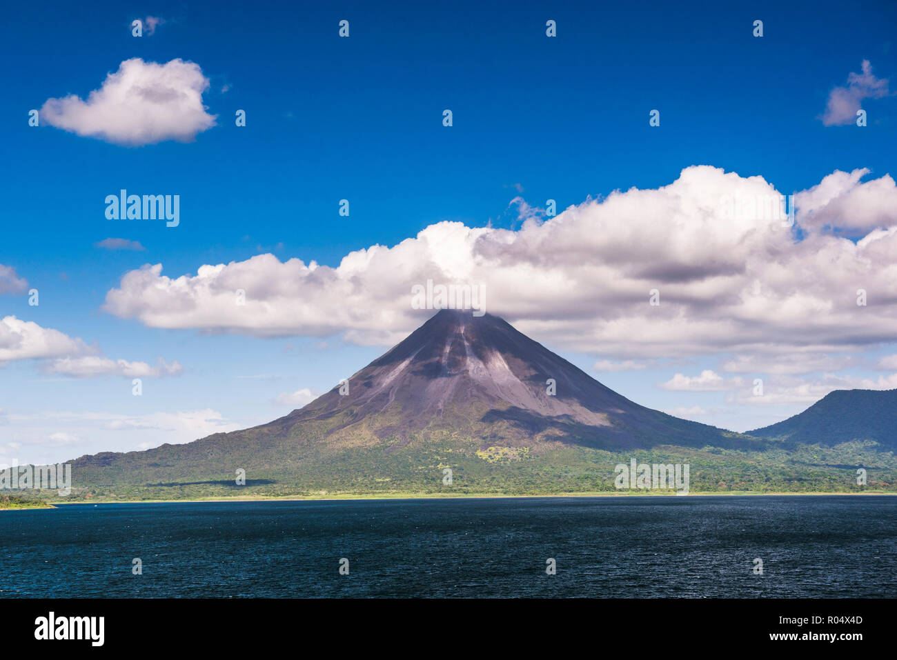 Arenal Volcano behind Laguna de Arenal (Arenal Lake), Alajuela Province ...