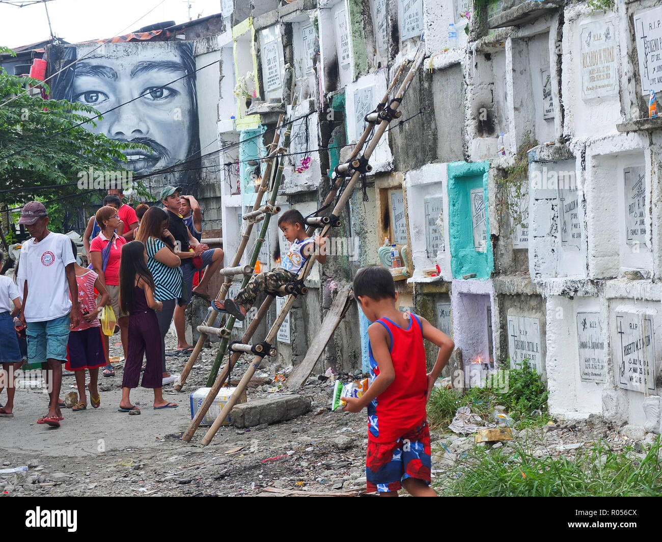 A boy enjoying himself sitting in a wooden ladder at the Navotas Public ...
